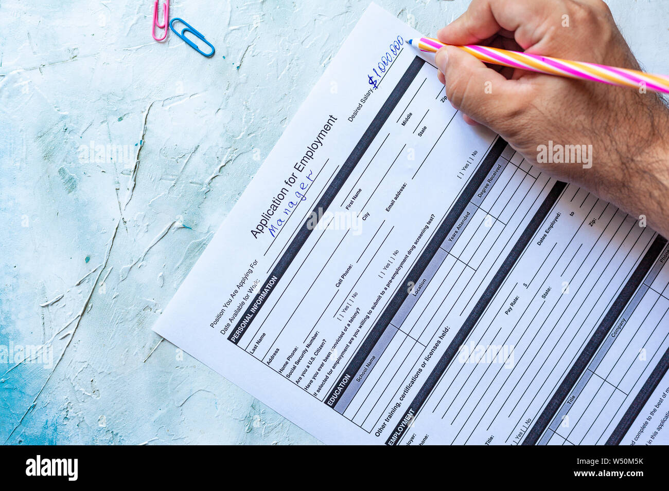 Hand filling Standard Application for Employment. HR, Hiring, Applicant ...