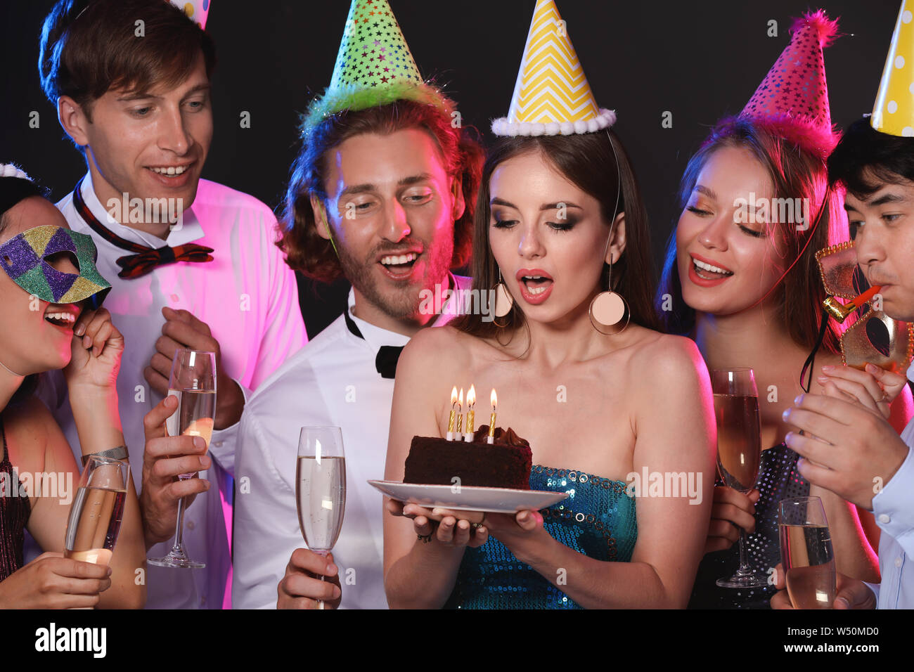 Group of friends celebrating Birthday in night club Stock Photo - Alamy