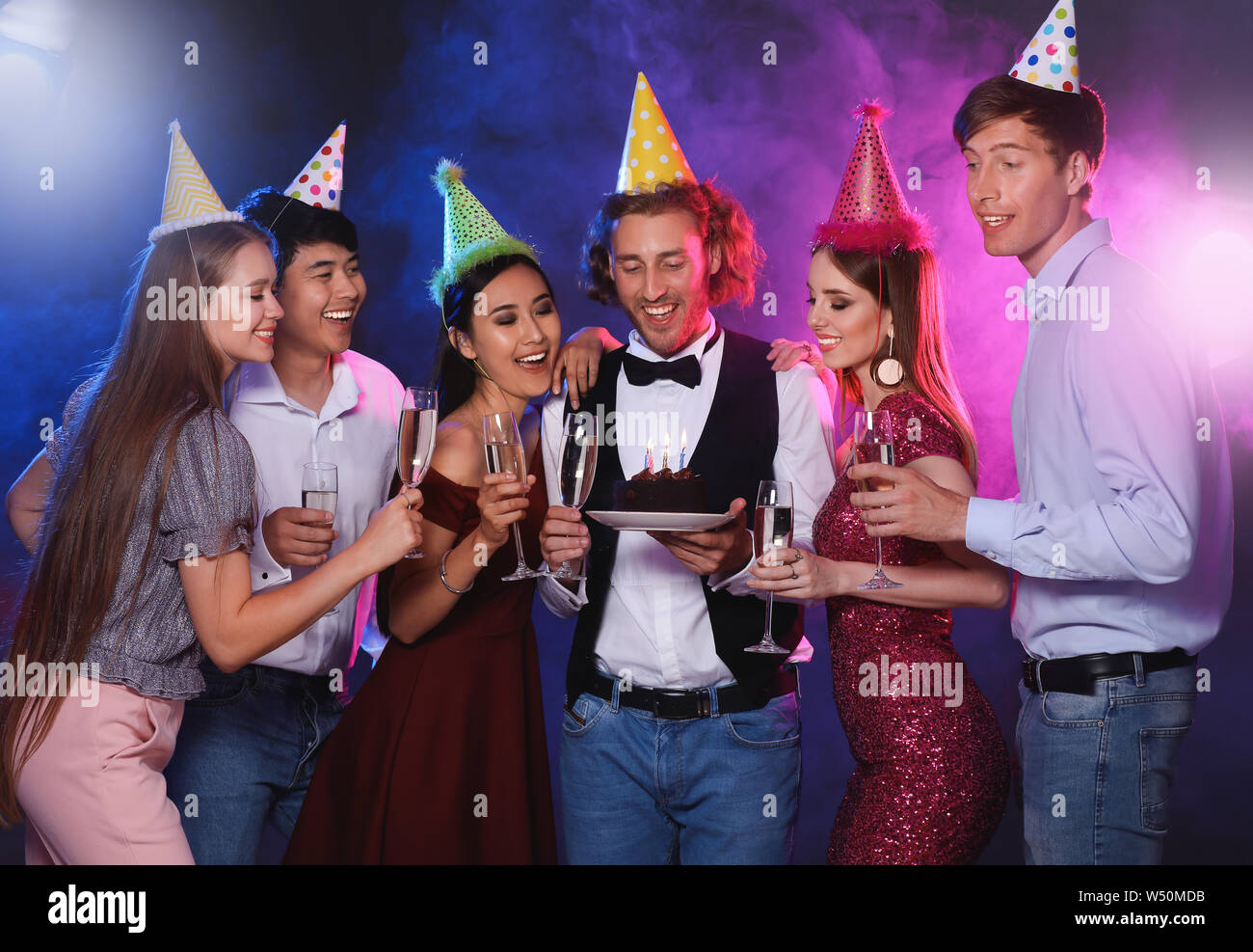 Group of friends celebrating Birthday in night club Stock Photo - Alamy