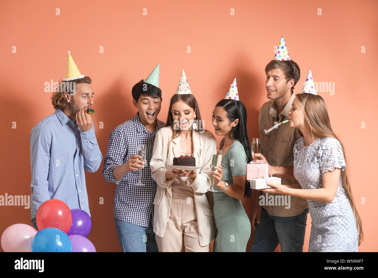 Group of friends celebrating Birthday on color background Stock Photo ...