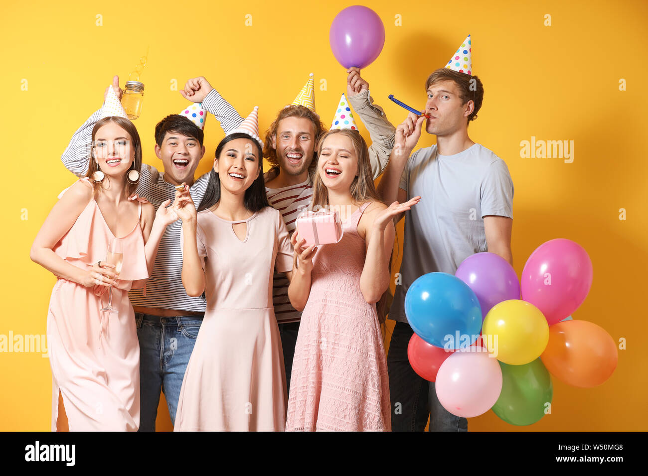 Group of friends celebrating Birthday on color background Stock Photo ...