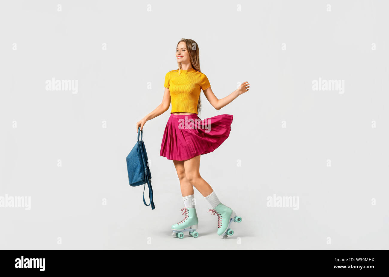 Beautiful Young Girl On Roller Skates Against Light Background Stock