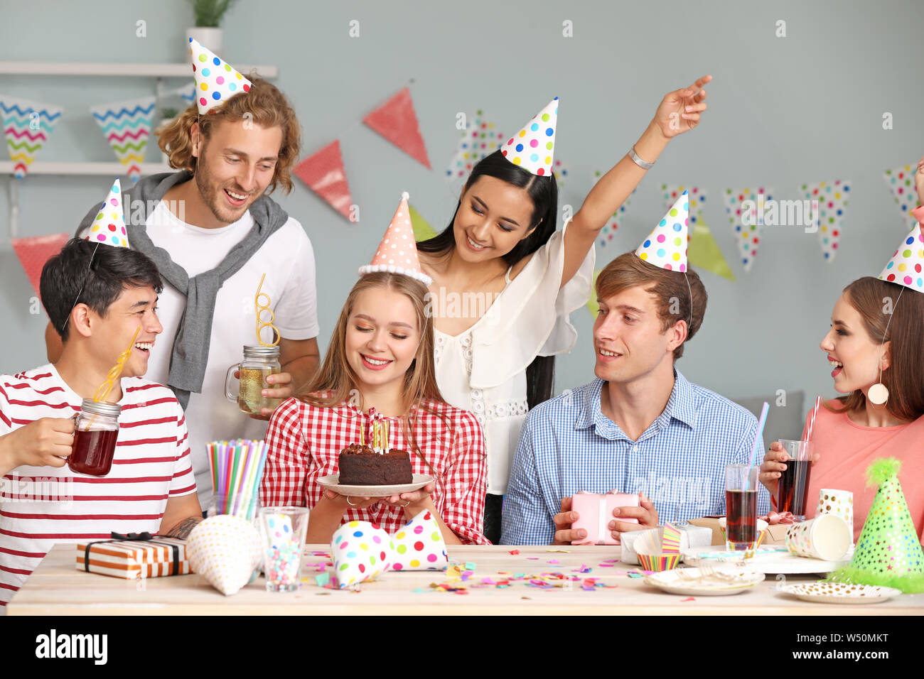 Group of friends celebrating Birthday at home Stock Photo - Alamy