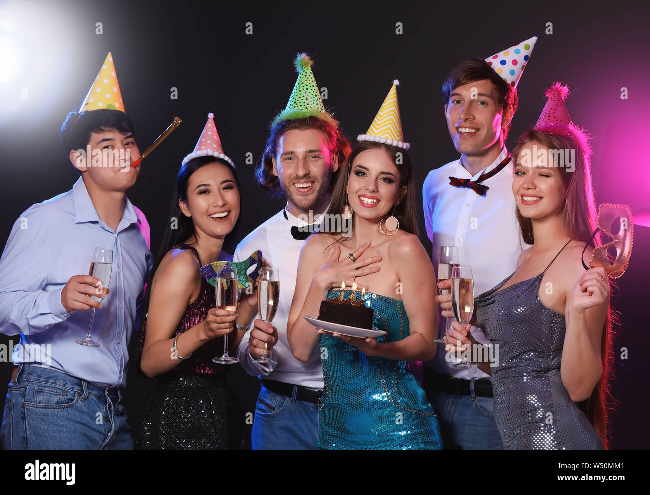 Group of friends celebrating Birthday in night club Stock Photo - Alamy