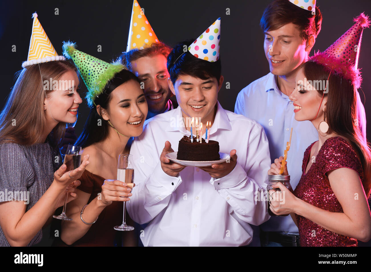 Group of friends celebrating Birthday in night club Stock Photo - Alamy