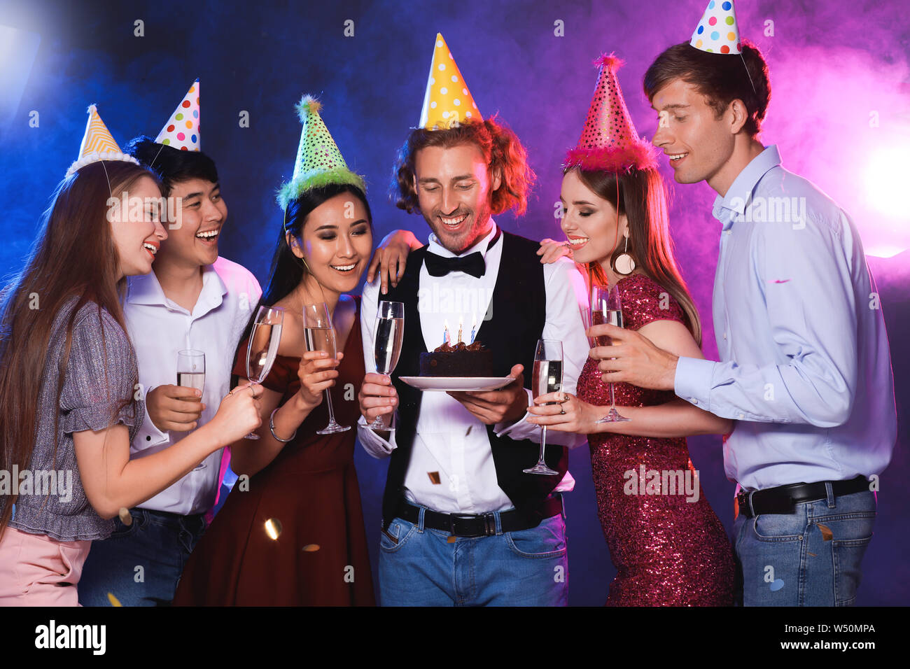 Group of friends celebrating Birthday in night club Stock Photo - Alamy