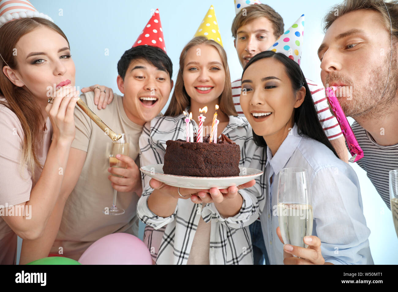 Group of friends celebrating Birthday on light background Stock Photo ...