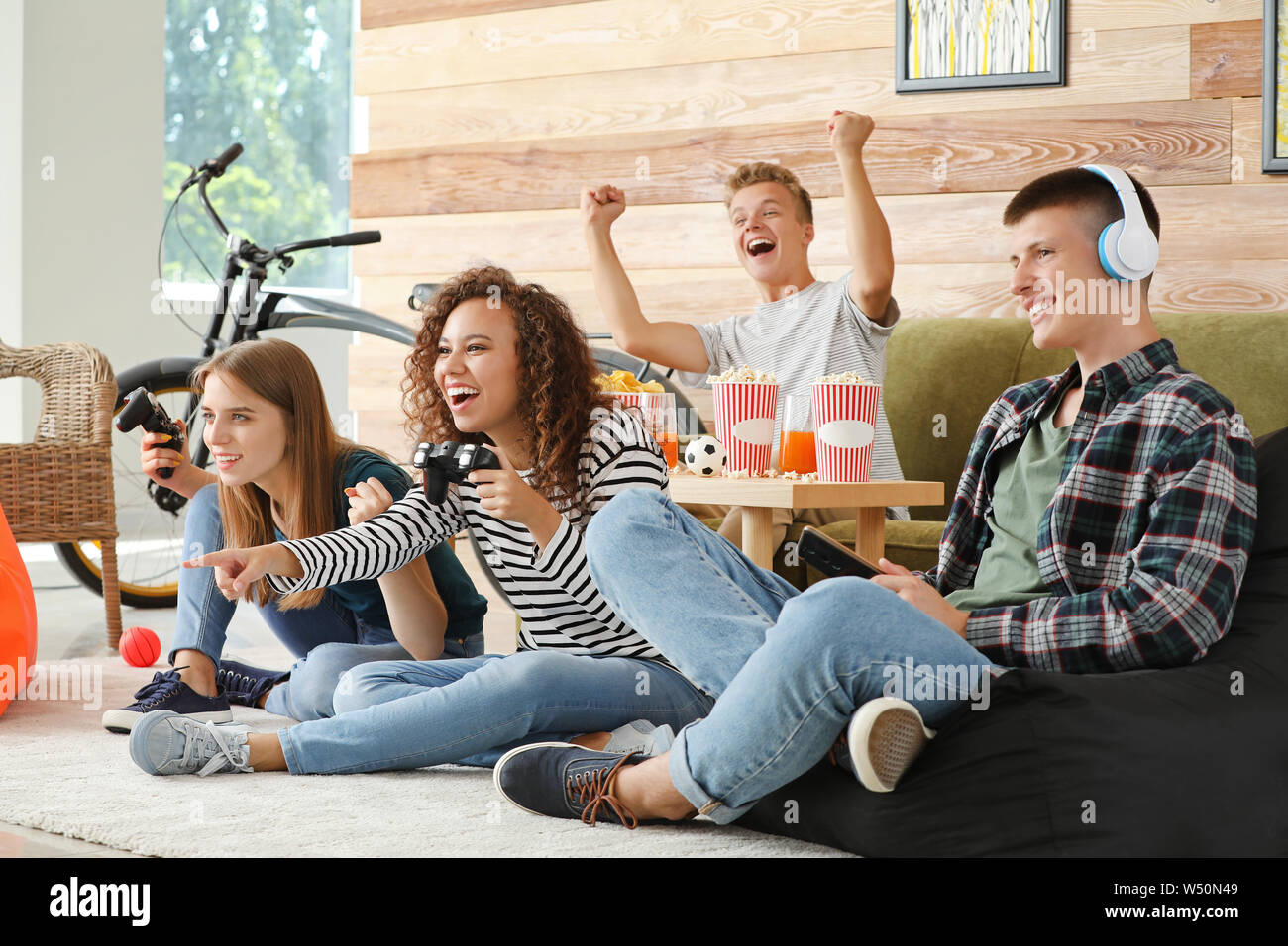 Teenagers playing online game hi-res stock photography and images - Alamy