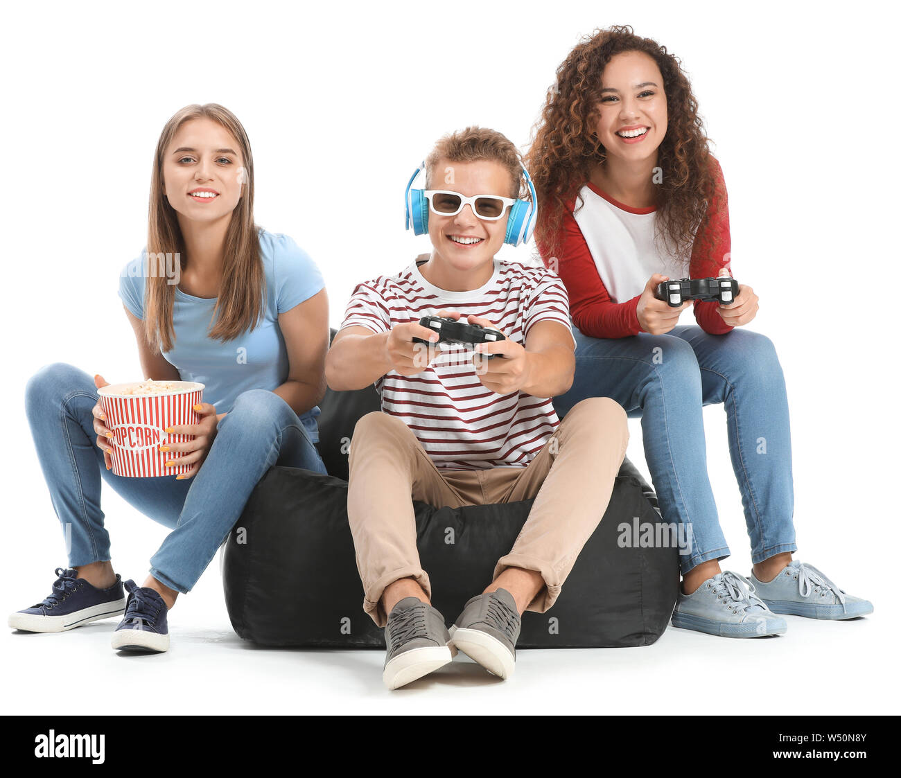 Teenagers playing video game on white background Stock Photo - Alamy