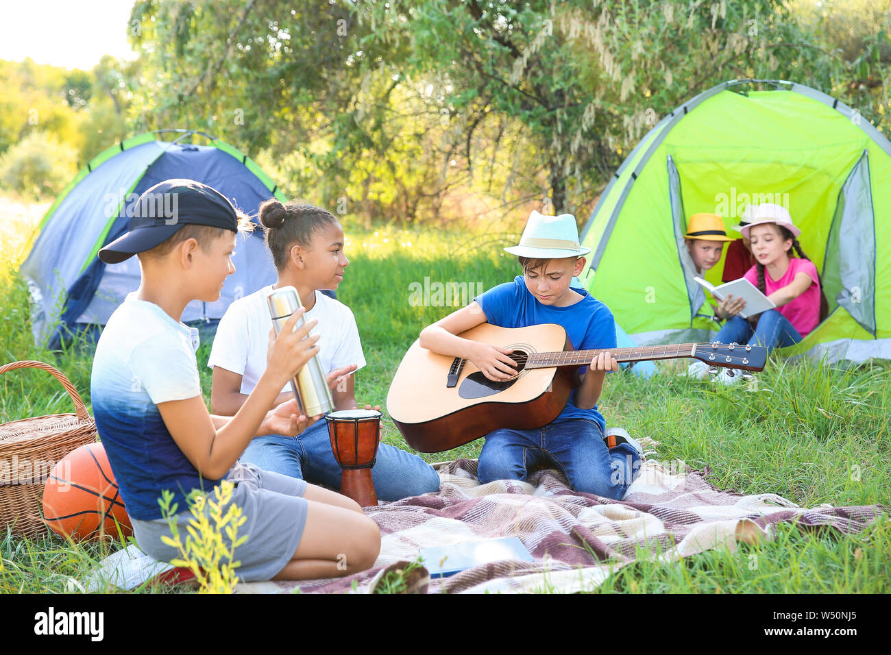 Group of children resting at summer camp Stock Photo - Alamy