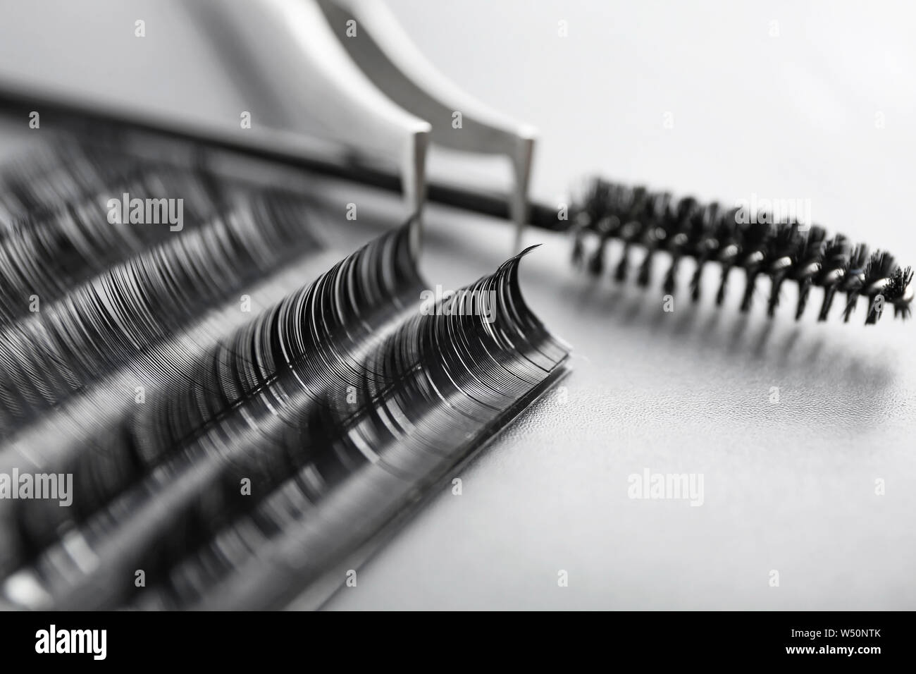 Set of eyelash extensions on grey background, closeup Stock Photo - Alamy