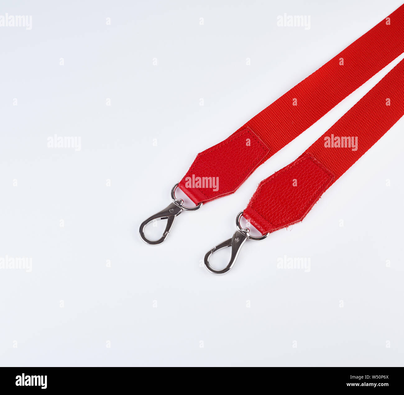red textile handles with clasps for a bag on a white background Stock ...