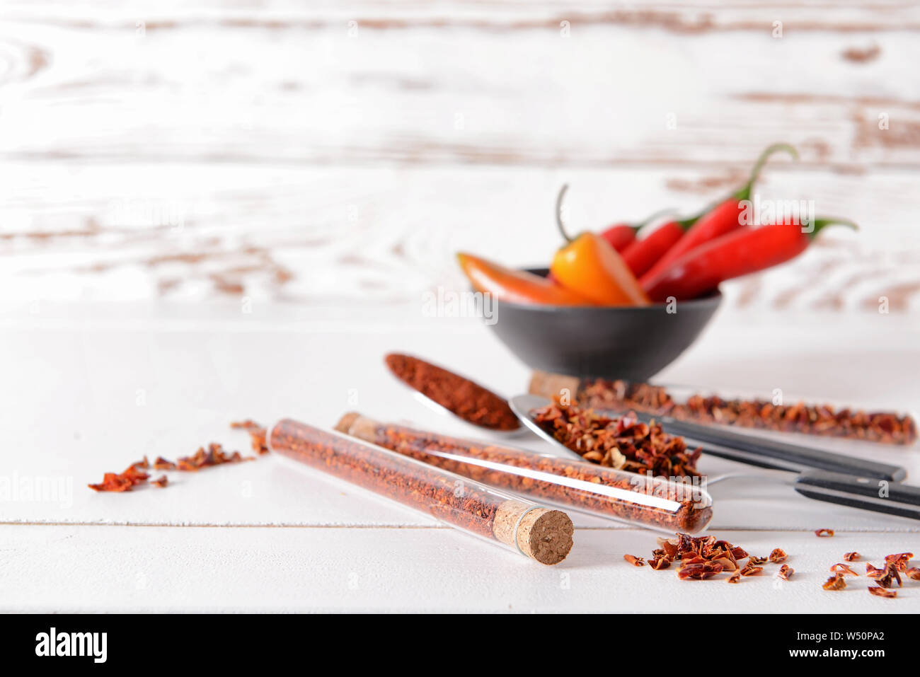 Dry pepper in tubes on white table Stock Photo - Alamy