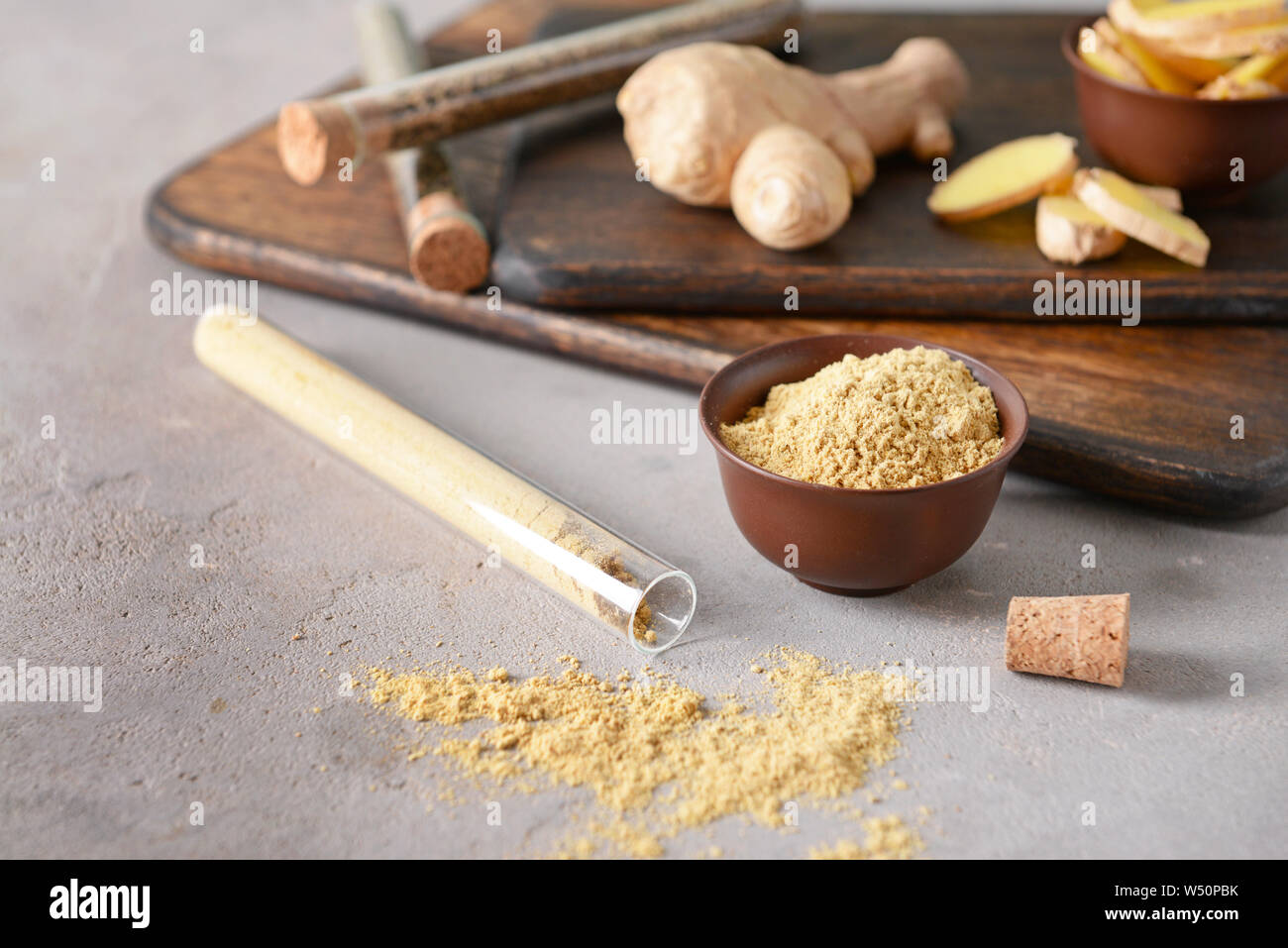 Powdered ginger on grey table Stock Photo - Alamy