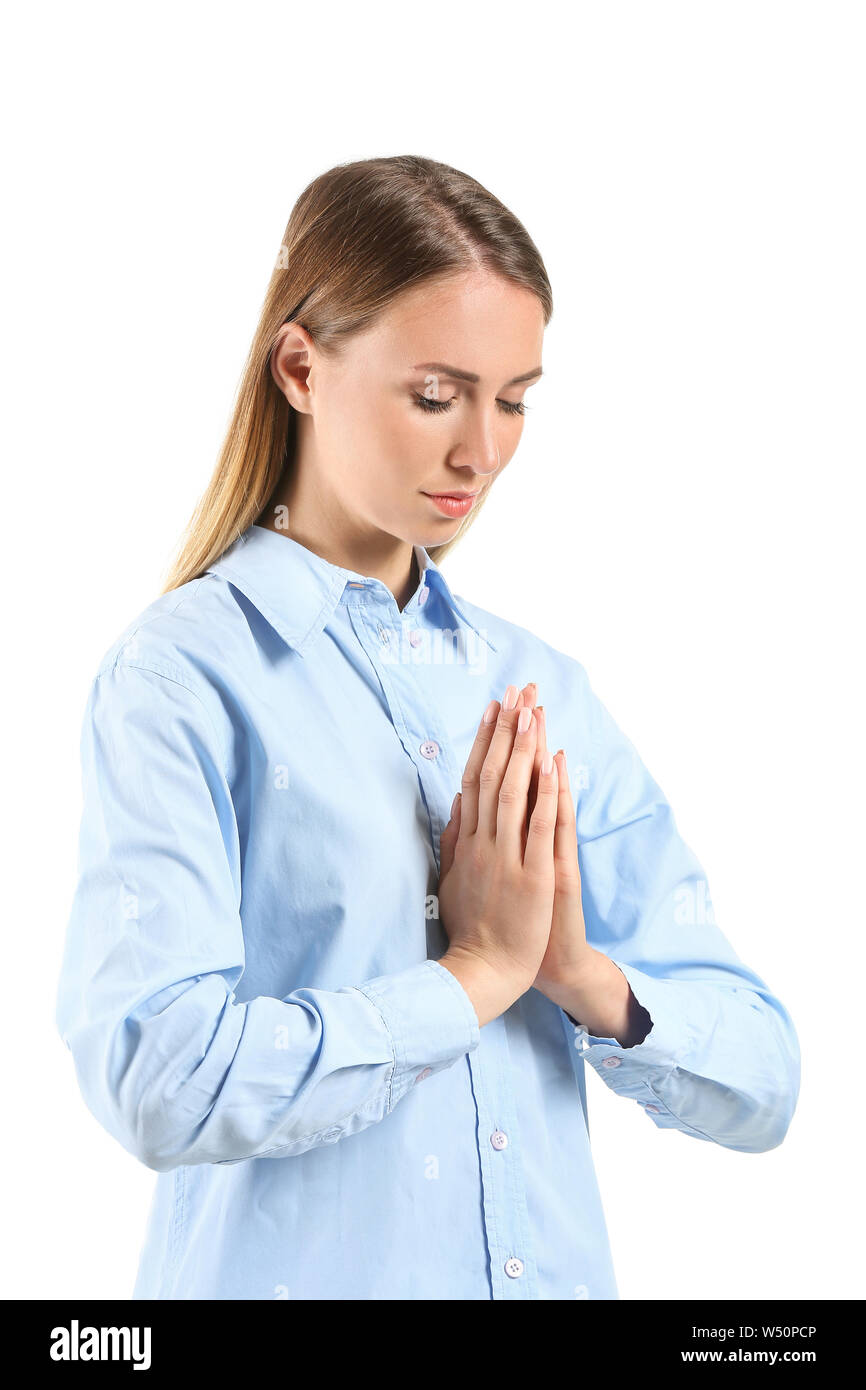 Religious young woman praying on white background Stock Photo - Alamy