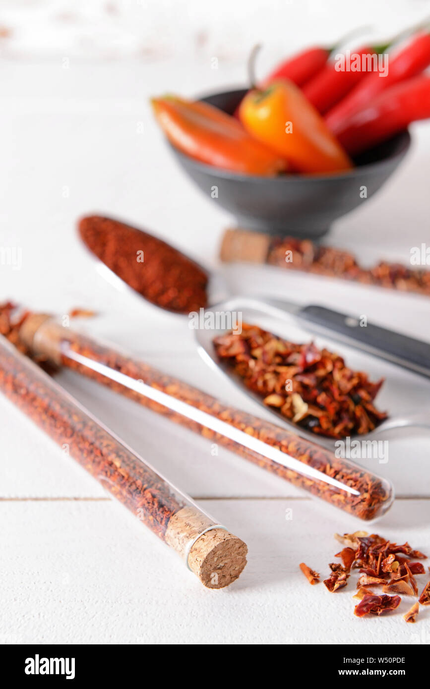 Dry pepper in tubes on white table Stock Photo - Alamy