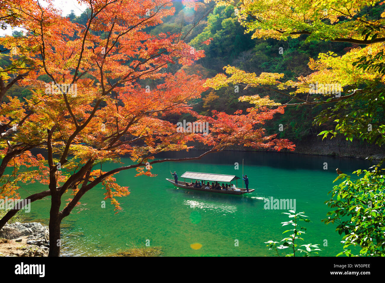 beautiful scene with tourist boat and Hozugawa river in Arashiyama park ...
