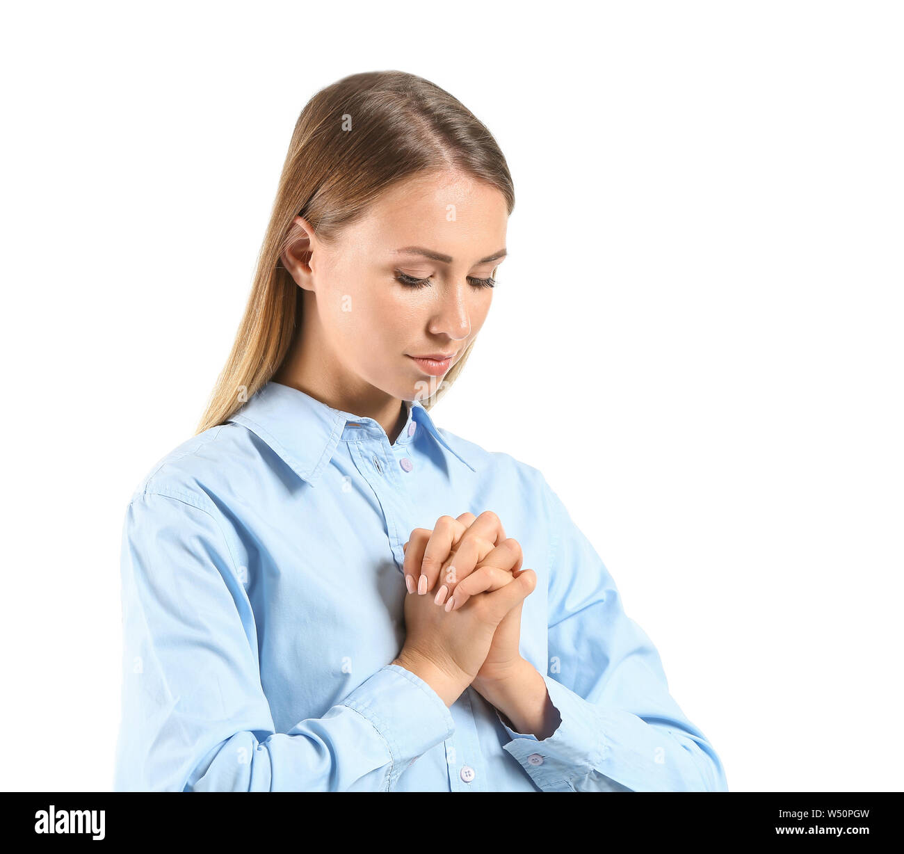 Religious young woman praying on white background Stock Photo - Alamy