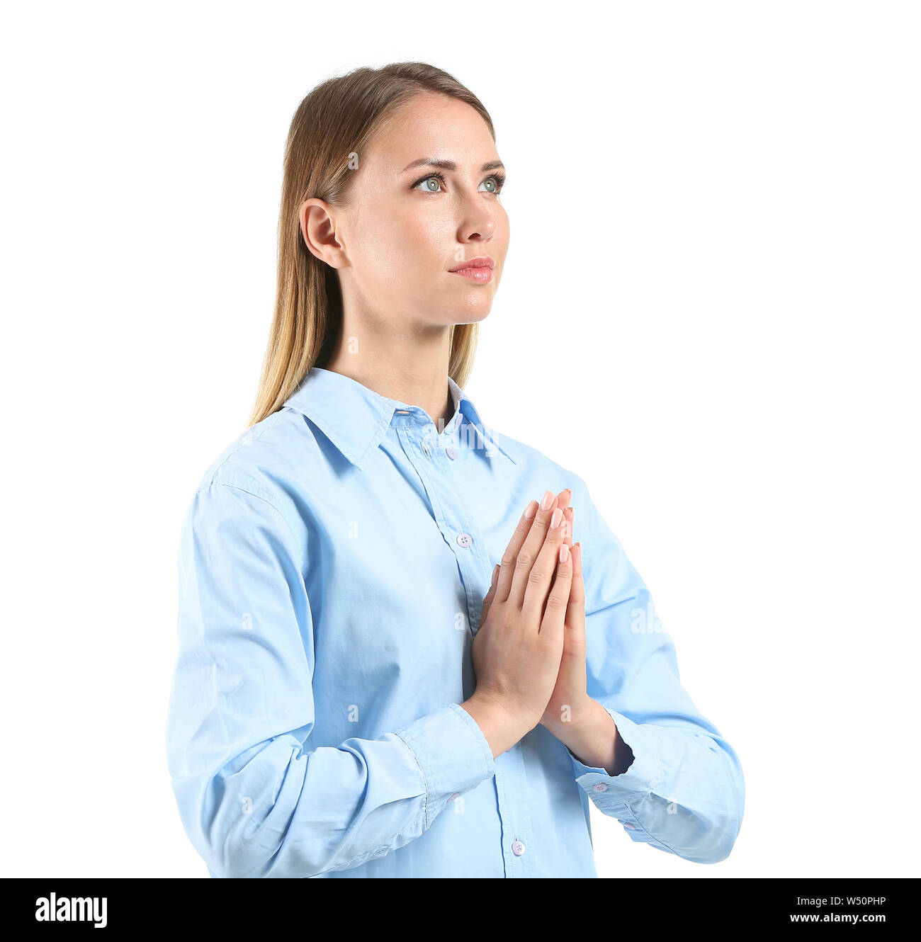 Religious young woman praying on white background Stock Photo - Alamy