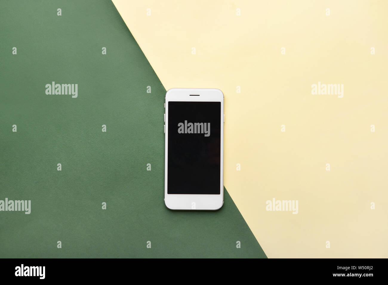 Modern mobile phone on color background Stock Photo - Alamy