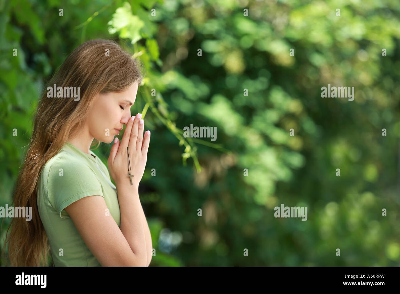 Religious woman praying to God outdoors Stock Photo - Alamy