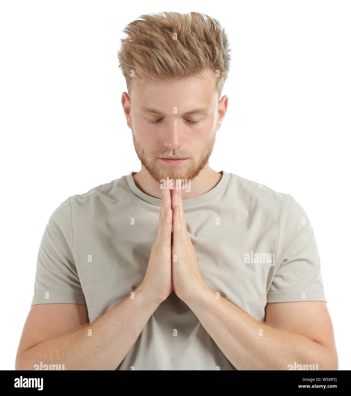Religious young man praying to God on white background Stock Photo - Alamy