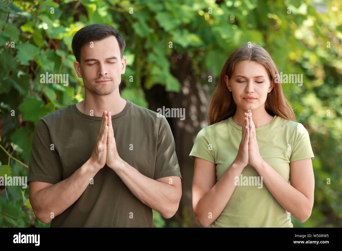 People Praying Together Outside