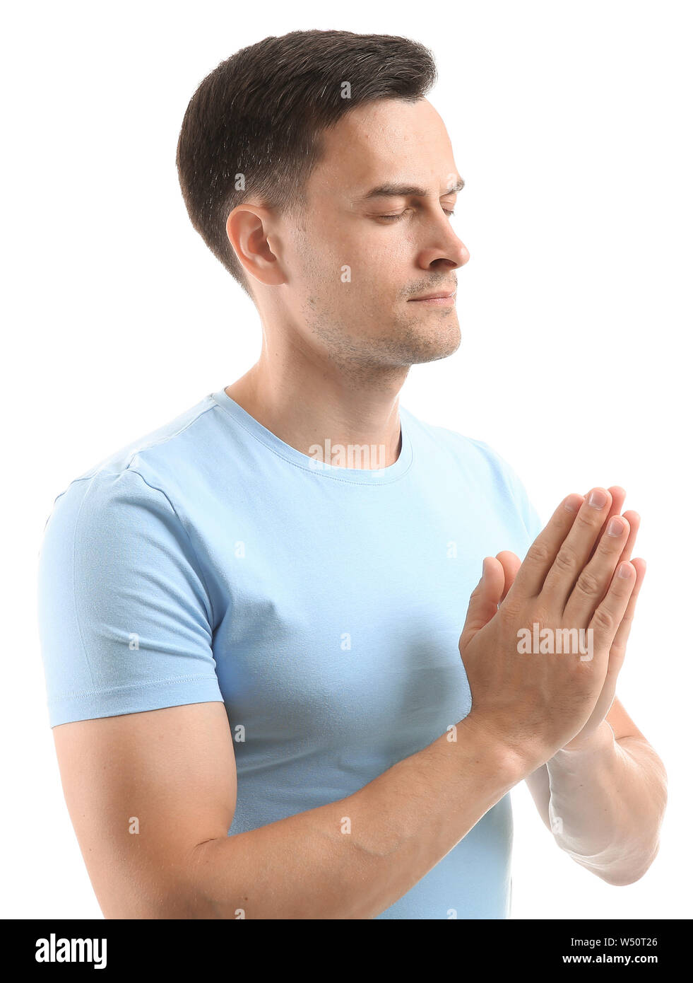 Religious man praying to God on white background Stock Photo - Alamy