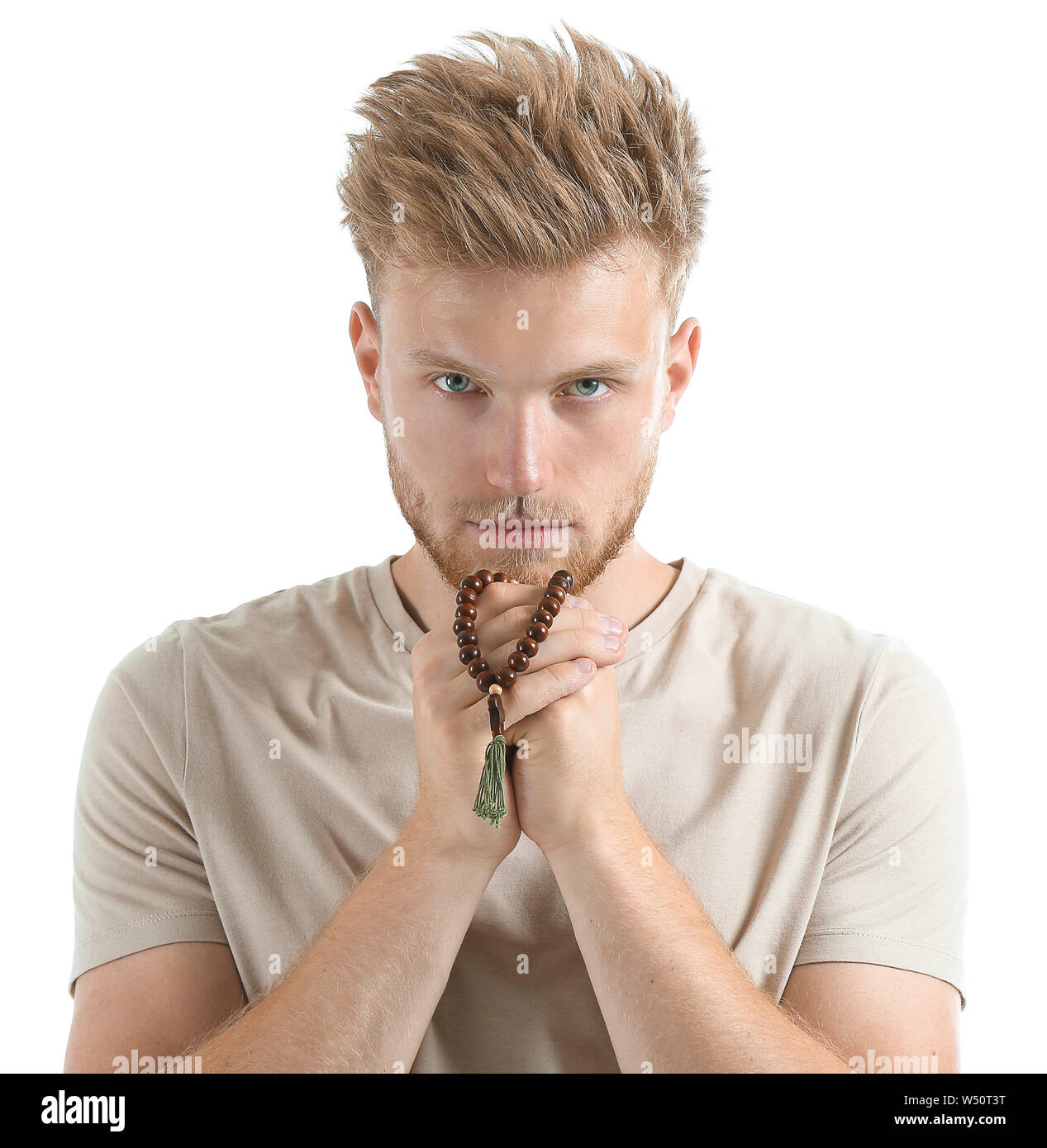 Religious young man praying to God on white background Stock Photo - Alamy