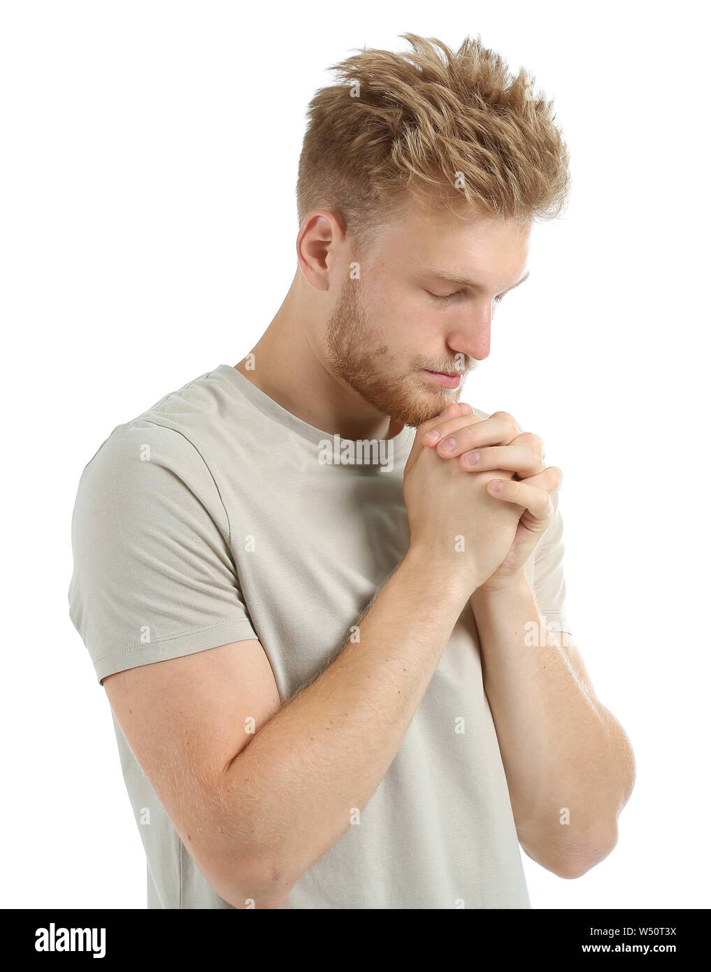 Religious young man praying to God on white background Stock Photo - Alamy