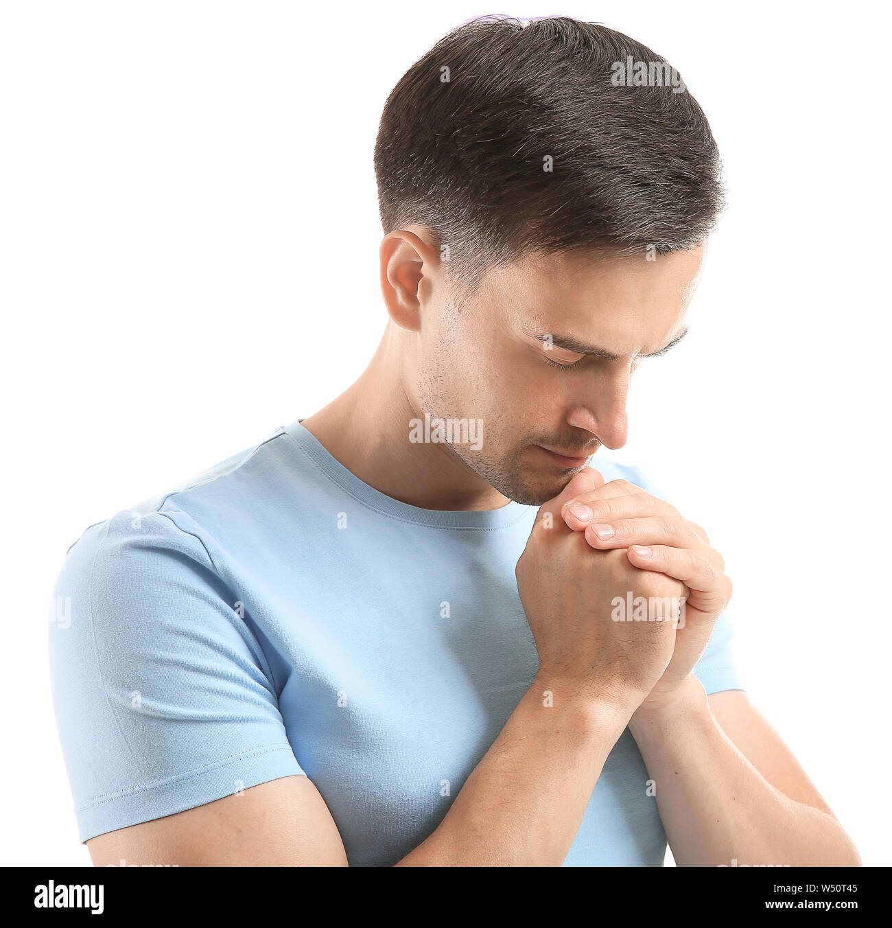 Religious man praying to God on white background Stock Photo - Alamy
