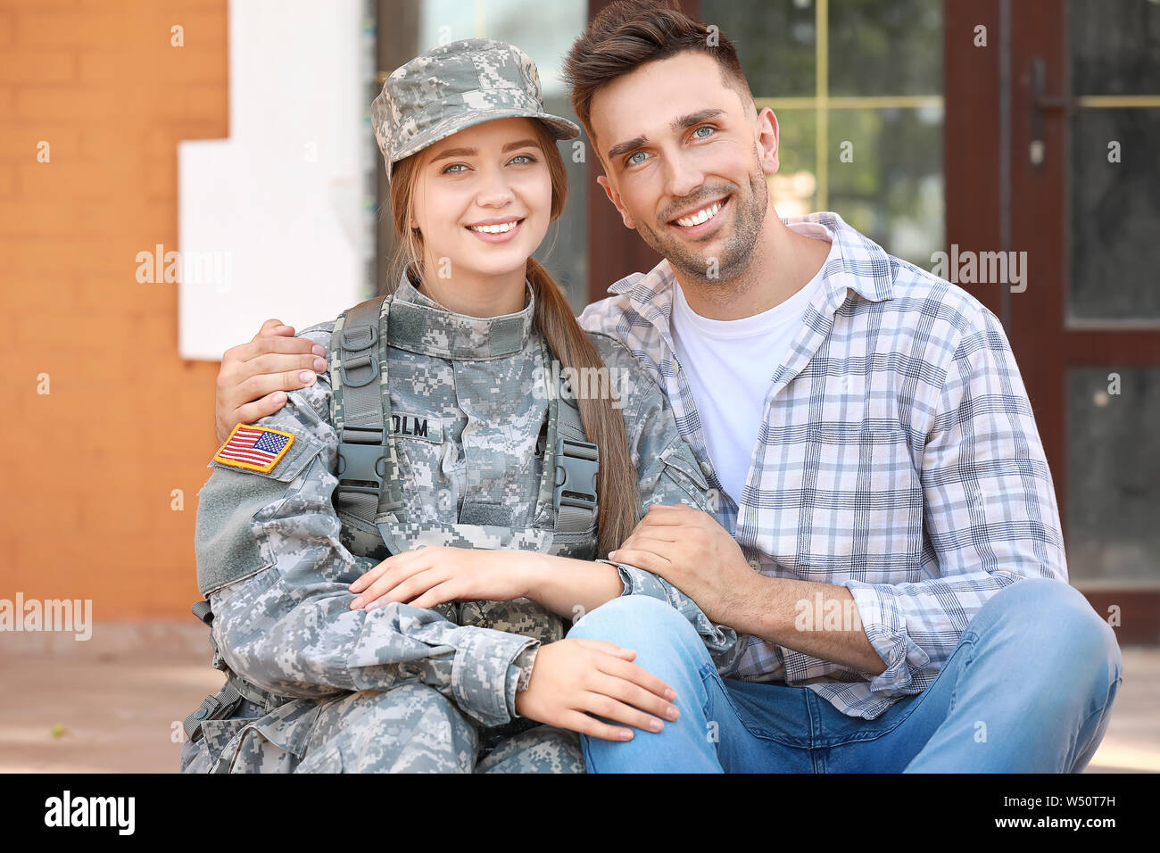 Happy female soldier with her husband outdoors Stock Photo - Alamy