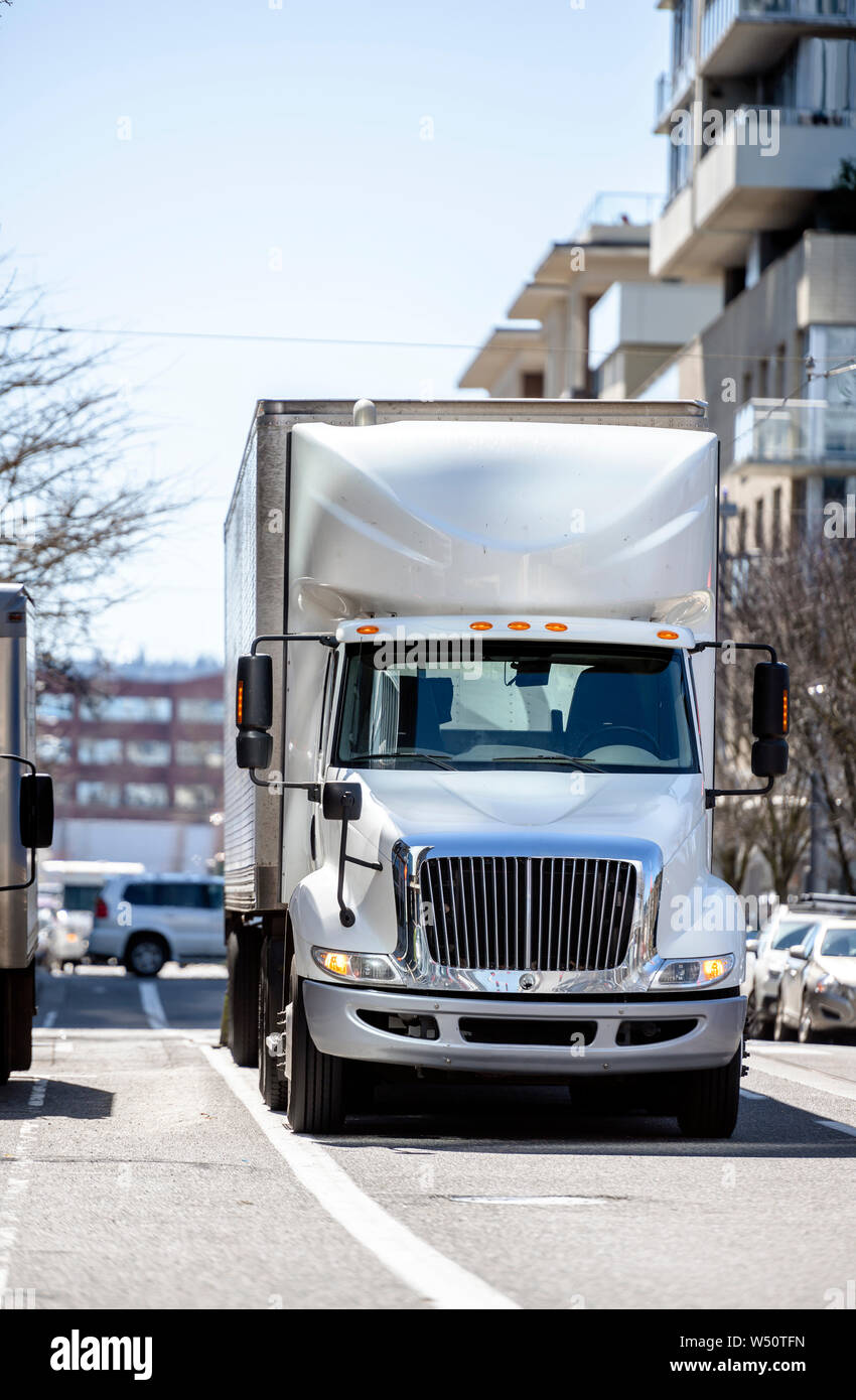 Day cab big rig white professional semi truck transporting commercial ...