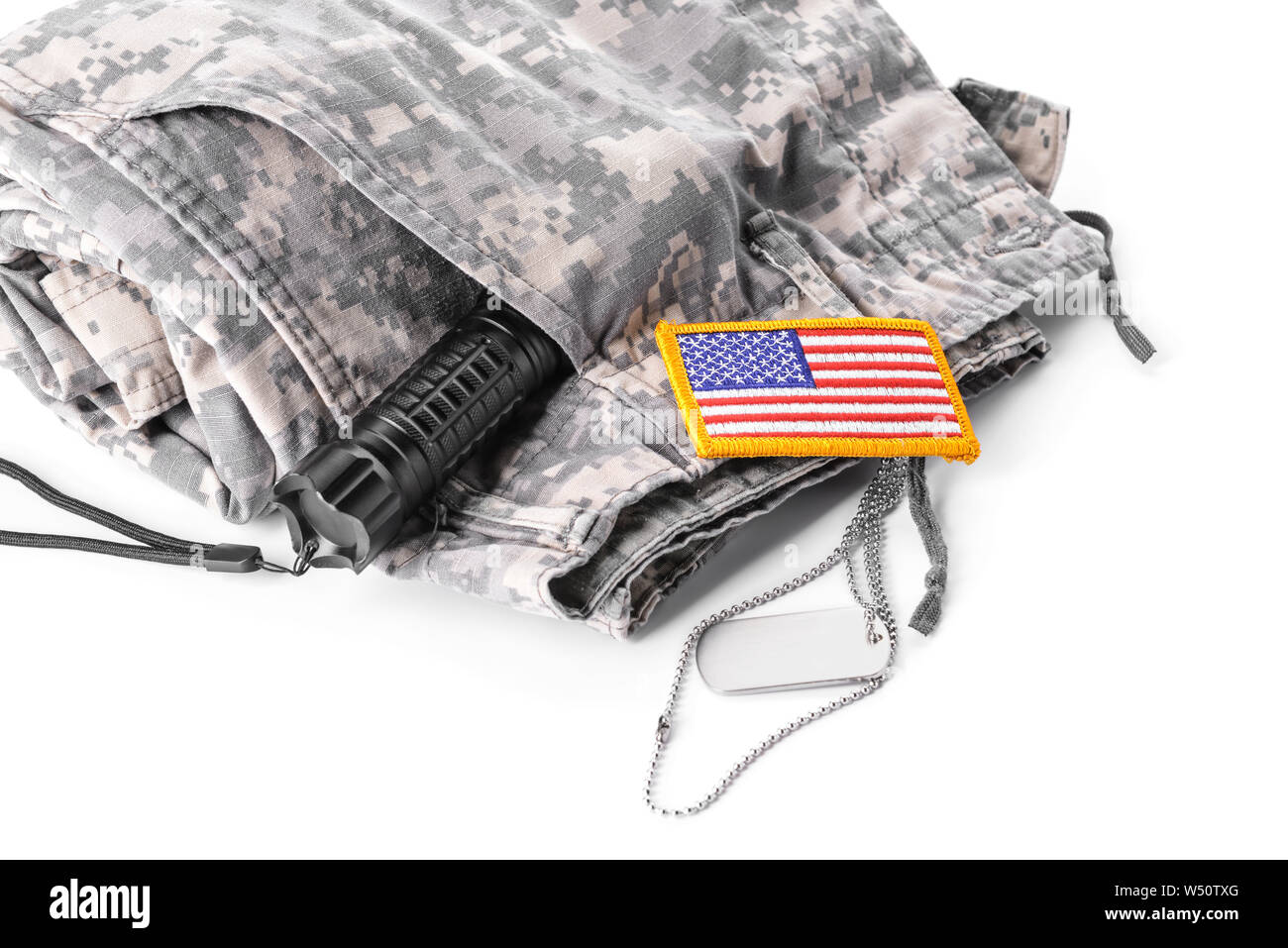 Uniform of USA army with dog tag and flashlight on white background ...