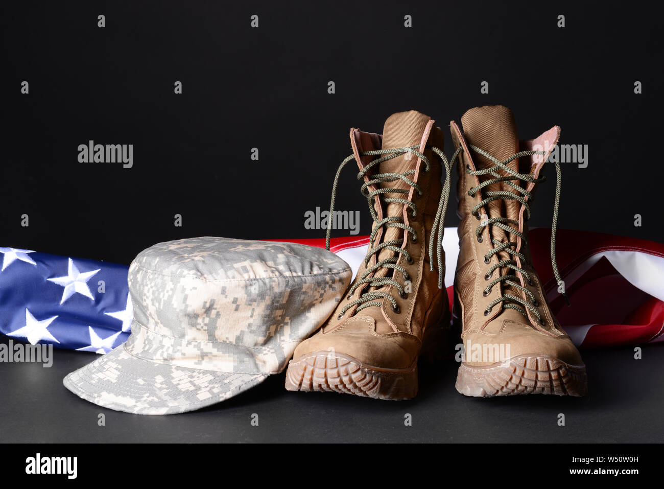Military boots, cap and USA flag on dark background Stock Photo - Alamy