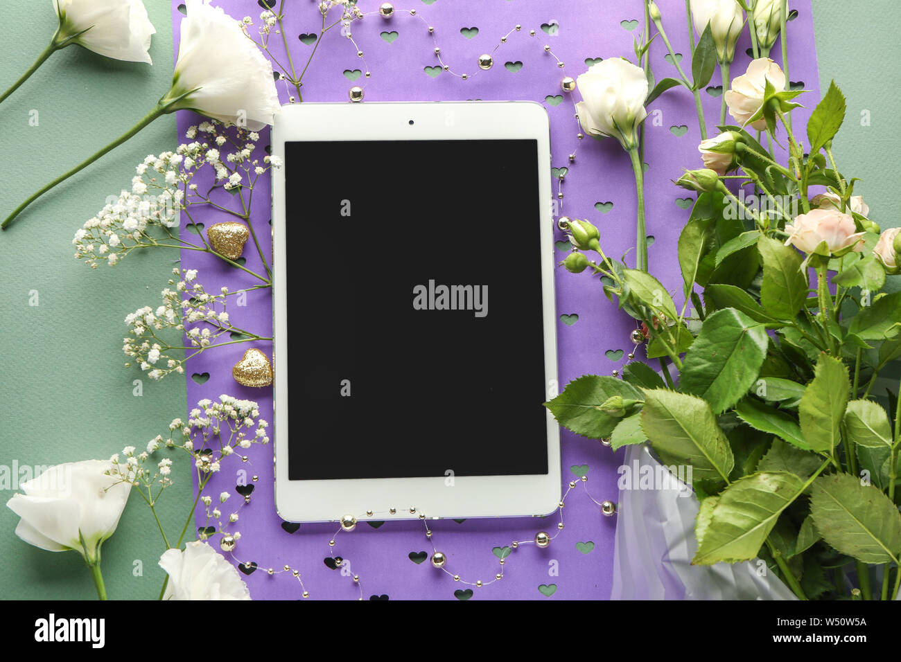 Modern tablet computer on workplace of florist Stock Photo - Alamy