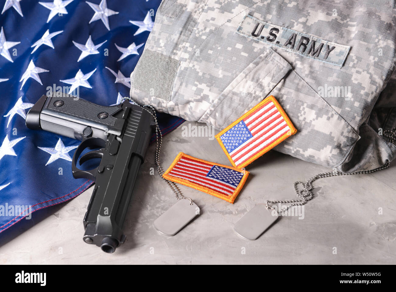 Military uniform, gun and USA flag on table Stock Photo - Alamy