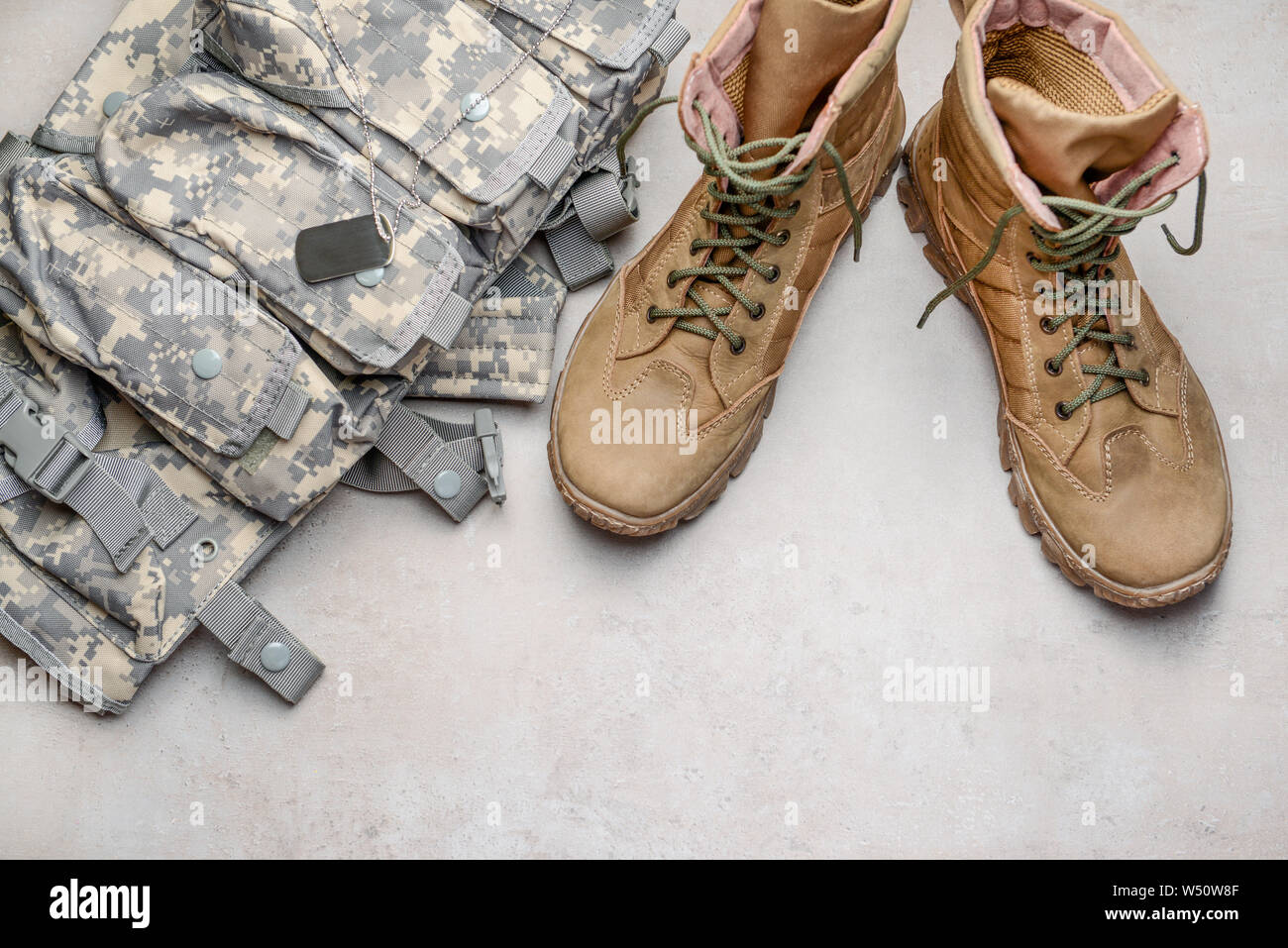 Military uniform on grey background Stock Photo - Alamy