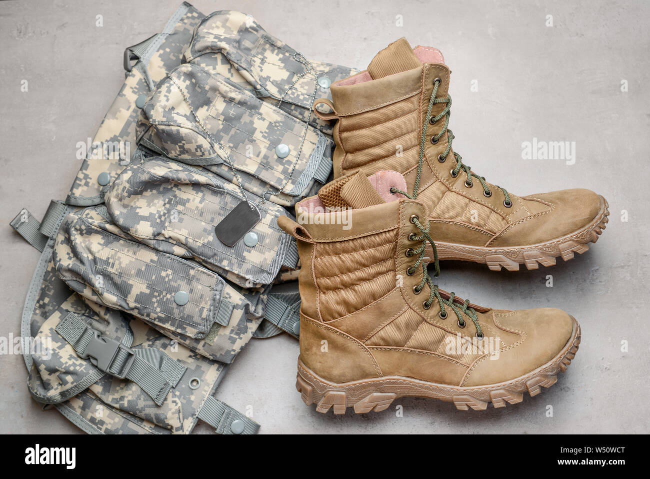 Military uniform on grey background Stock Photo - Alamy
