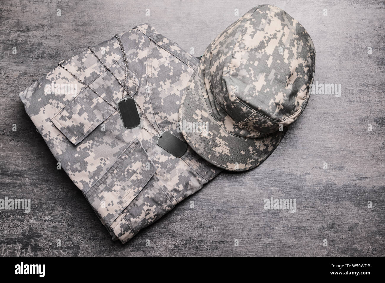 Military uniform on grey background Stock Photo - Alamy