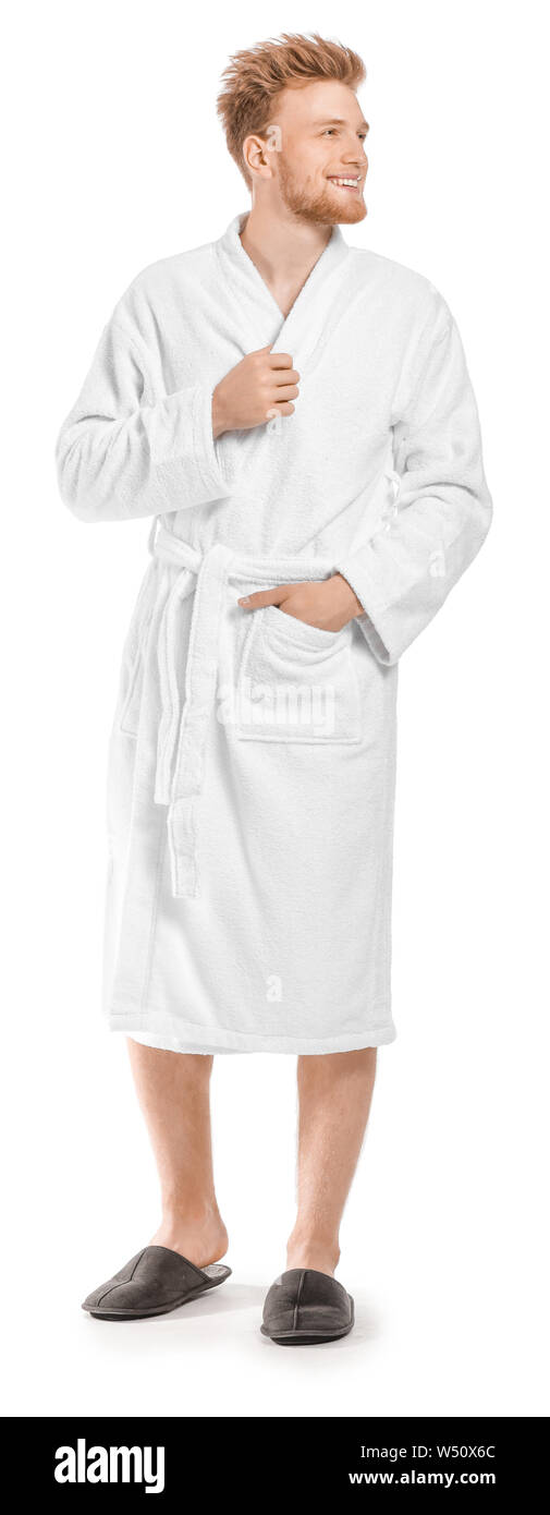 Handsome young man in bathrobe on white background Stock Photo - Alamy