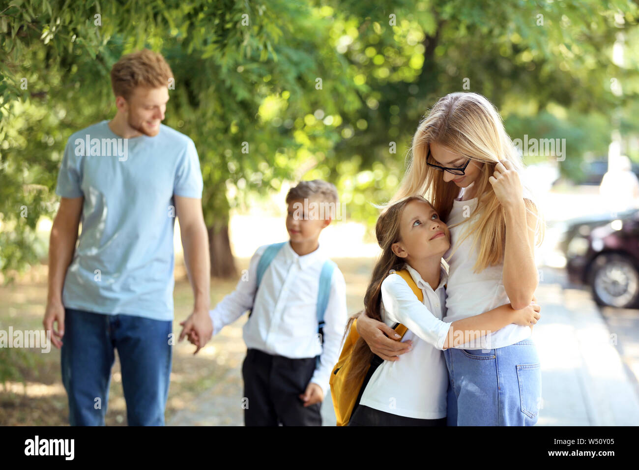 Little children going to school with their parents Stock Photo - Alamy