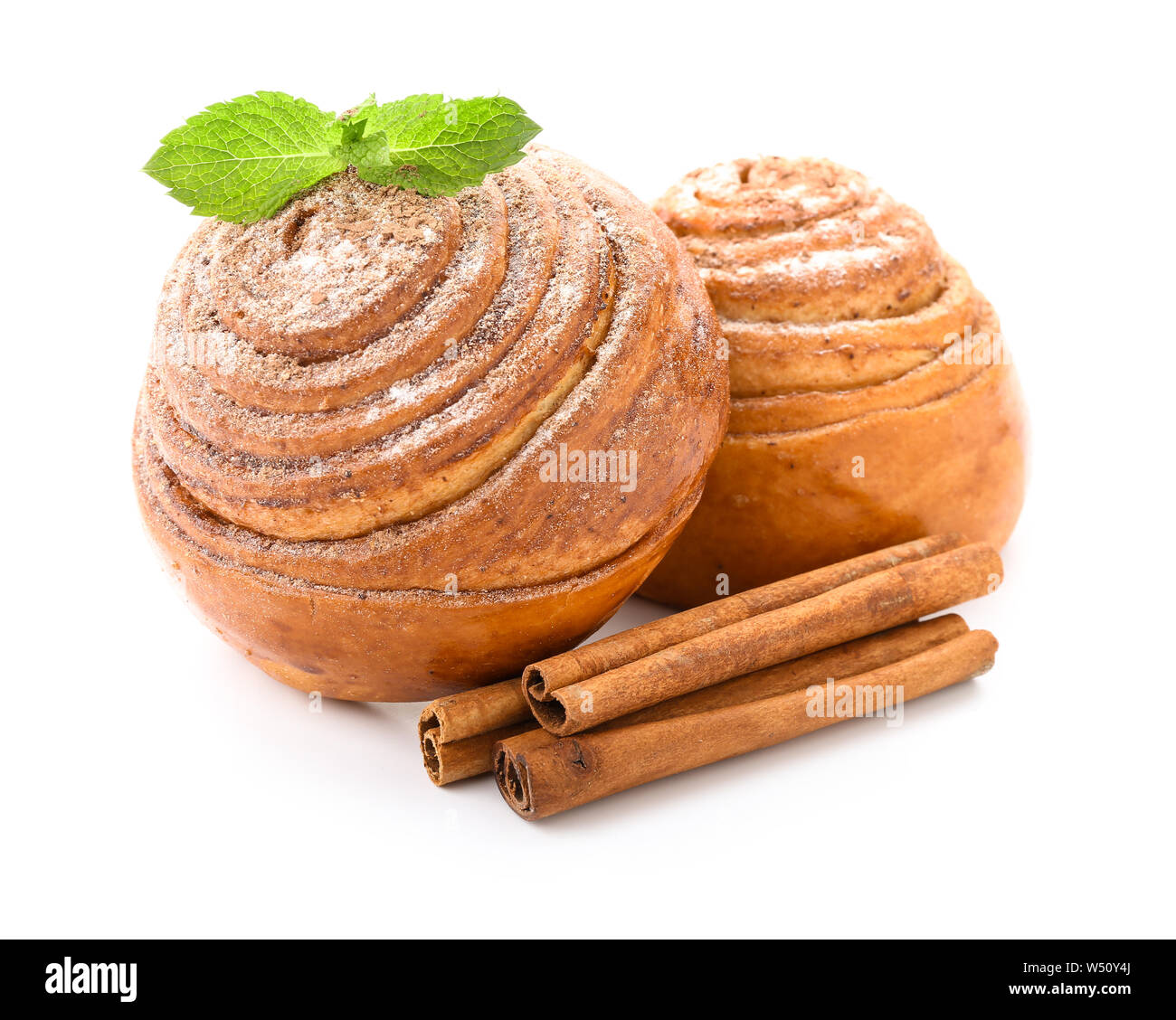 Tasty cinnamon buns on white background Stock Photo - Alamy