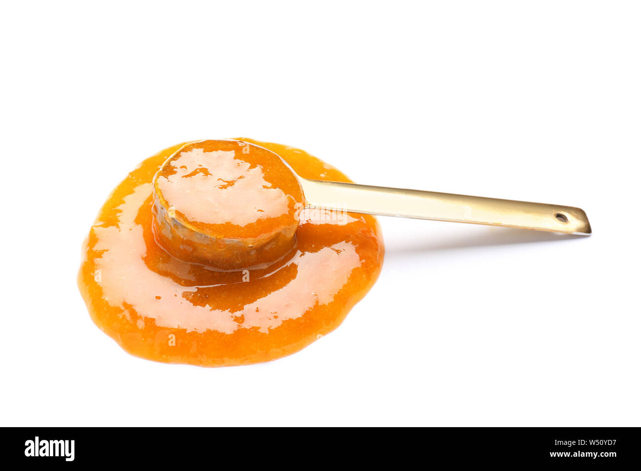 Scoop with tasty apricot jam on white background Stock Photo - Alamy