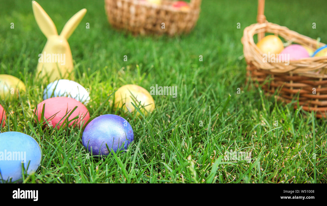 Colorful Easter eggs on grass outdoors Stock Photo - Alamy