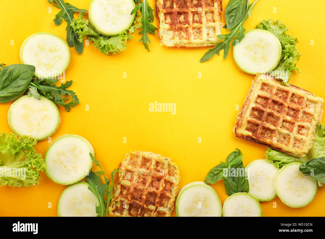 Frame made of tasty squash waffles on color background Stock Photo - Alamy