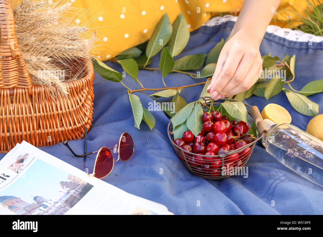 Woman eating tasty fresh cherries outdoors Stock Photo - Alamy
