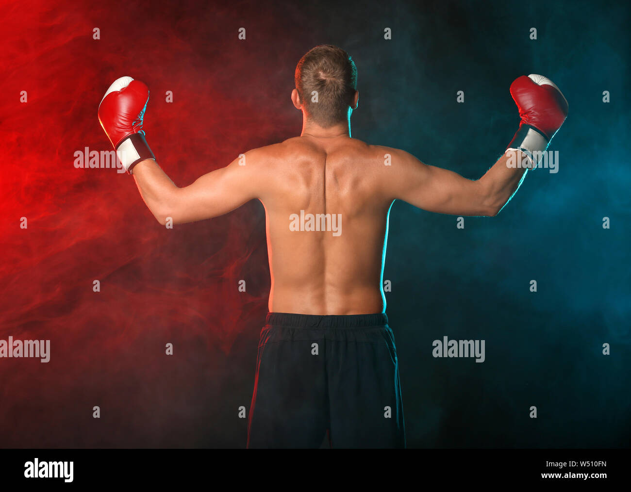 Strong male boxer on dark background Stock Photo - Alamy