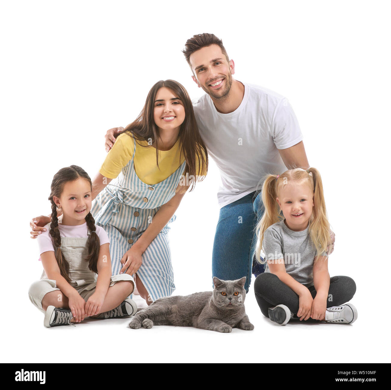 Happy family with cute cat on white background Stock Photo - Alamy