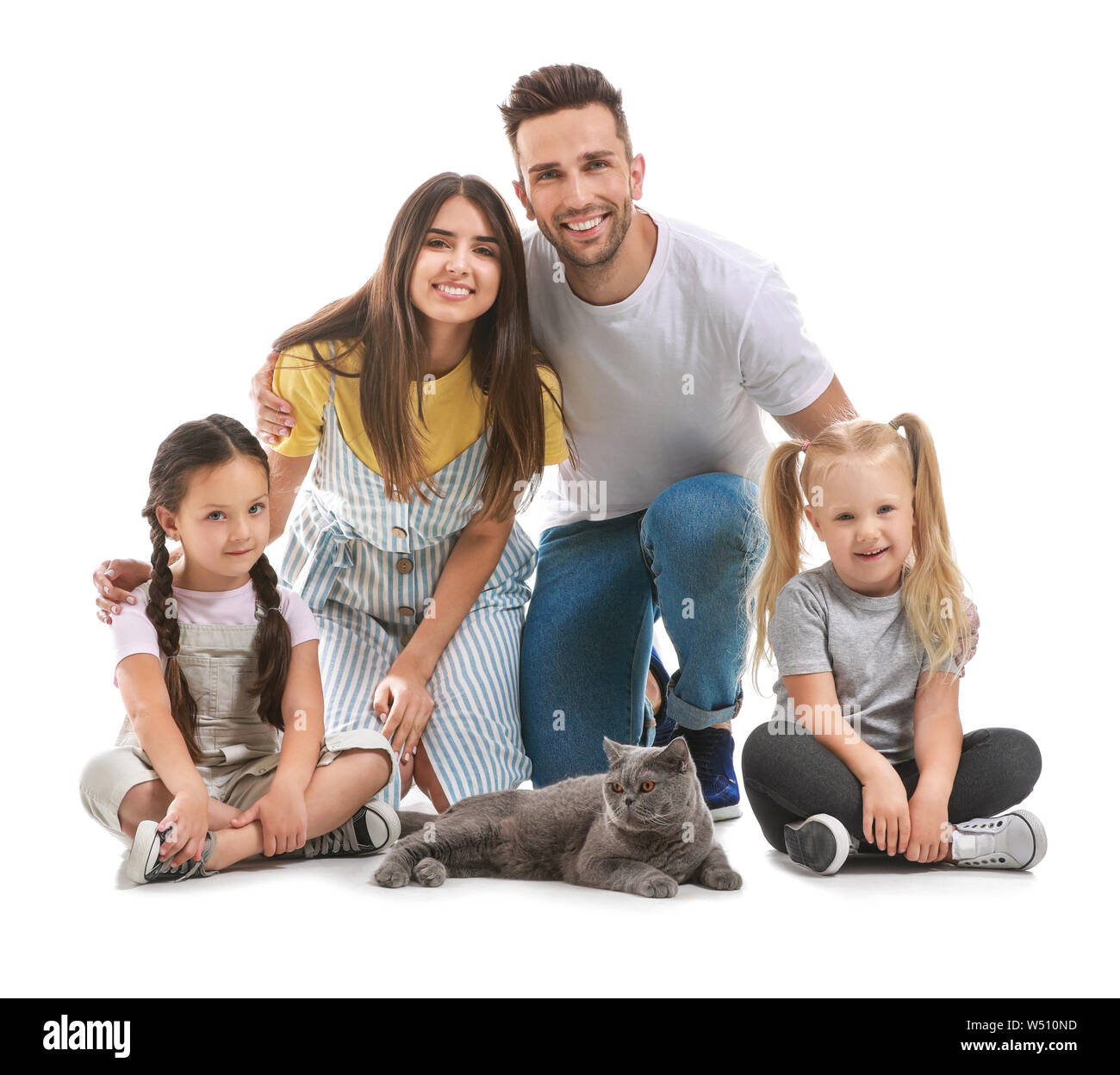 Happy family with cute cat on white background Stock Photo - Alamy